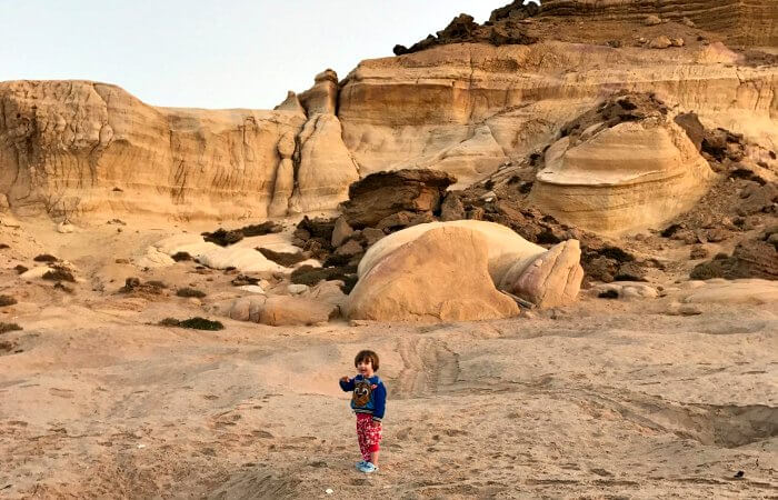 700x450 Oman toddler on beach 6 - Stubborn Mule Travel